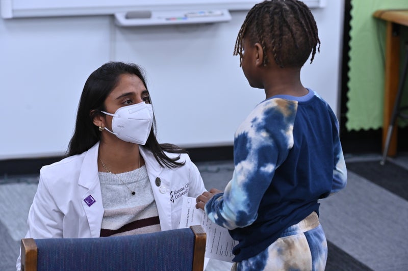 KCU staff and faculty volunteers assist with Score 1 for Health