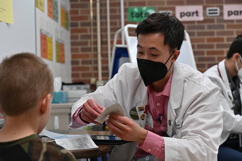 KCU staff and faculty volunteers assist with Score 1 for Health