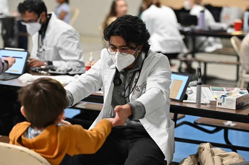 KCU staff and faculty volunteers assist with Score 1 for Health